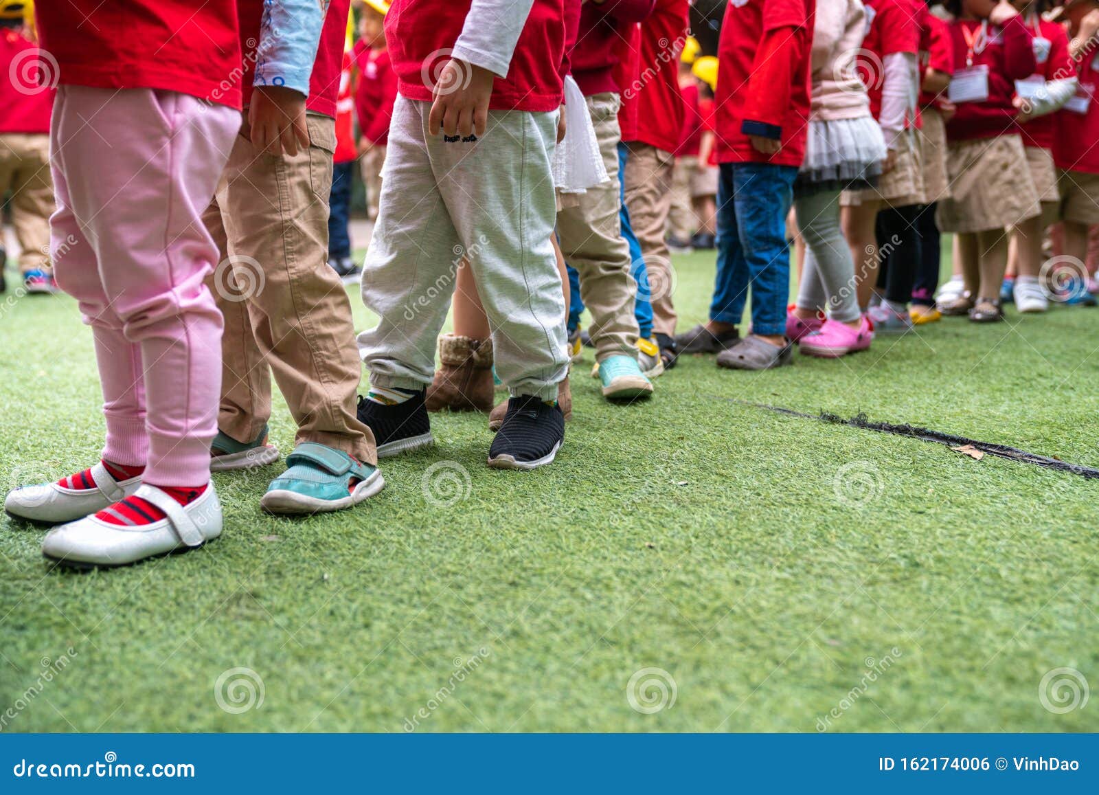 Queue of Asian Kids in School Uniform Standing in Line Stock Photo ...