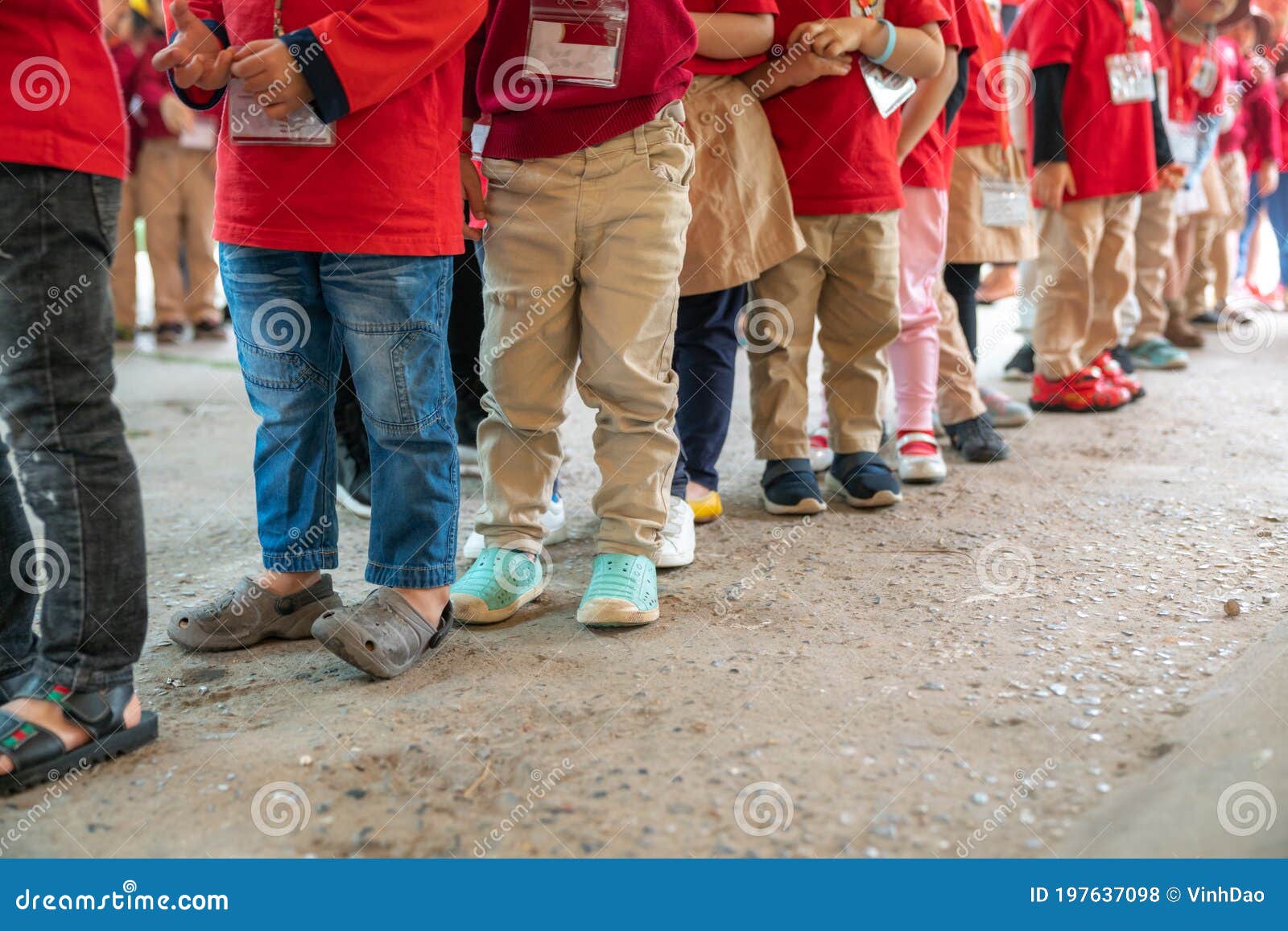Queue Of Asian Kids In School Uniform Standing In Line Royalty-Free ...