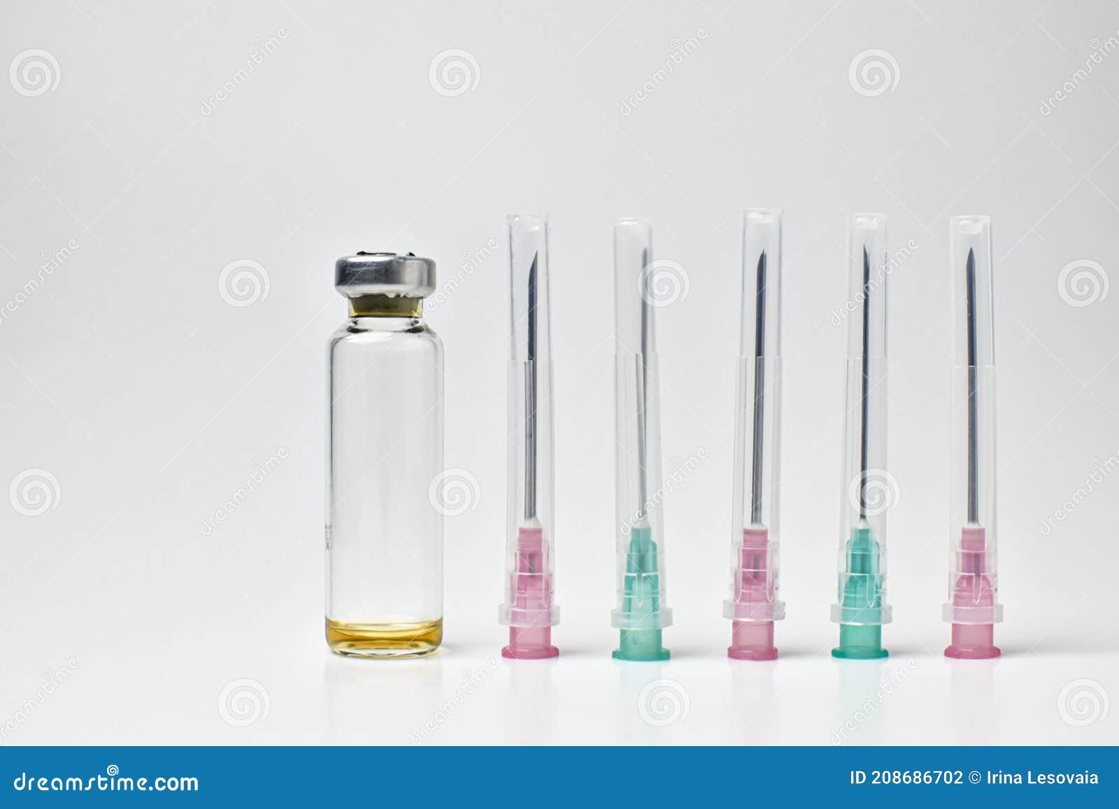 The Queue for Vaccination. Injection Needles with a Bottle of Vaccine ...