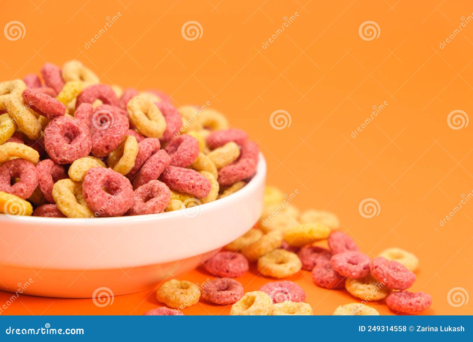 Quick Cereal Breakfast in the Form of Rings on a Plate on an Orange ...