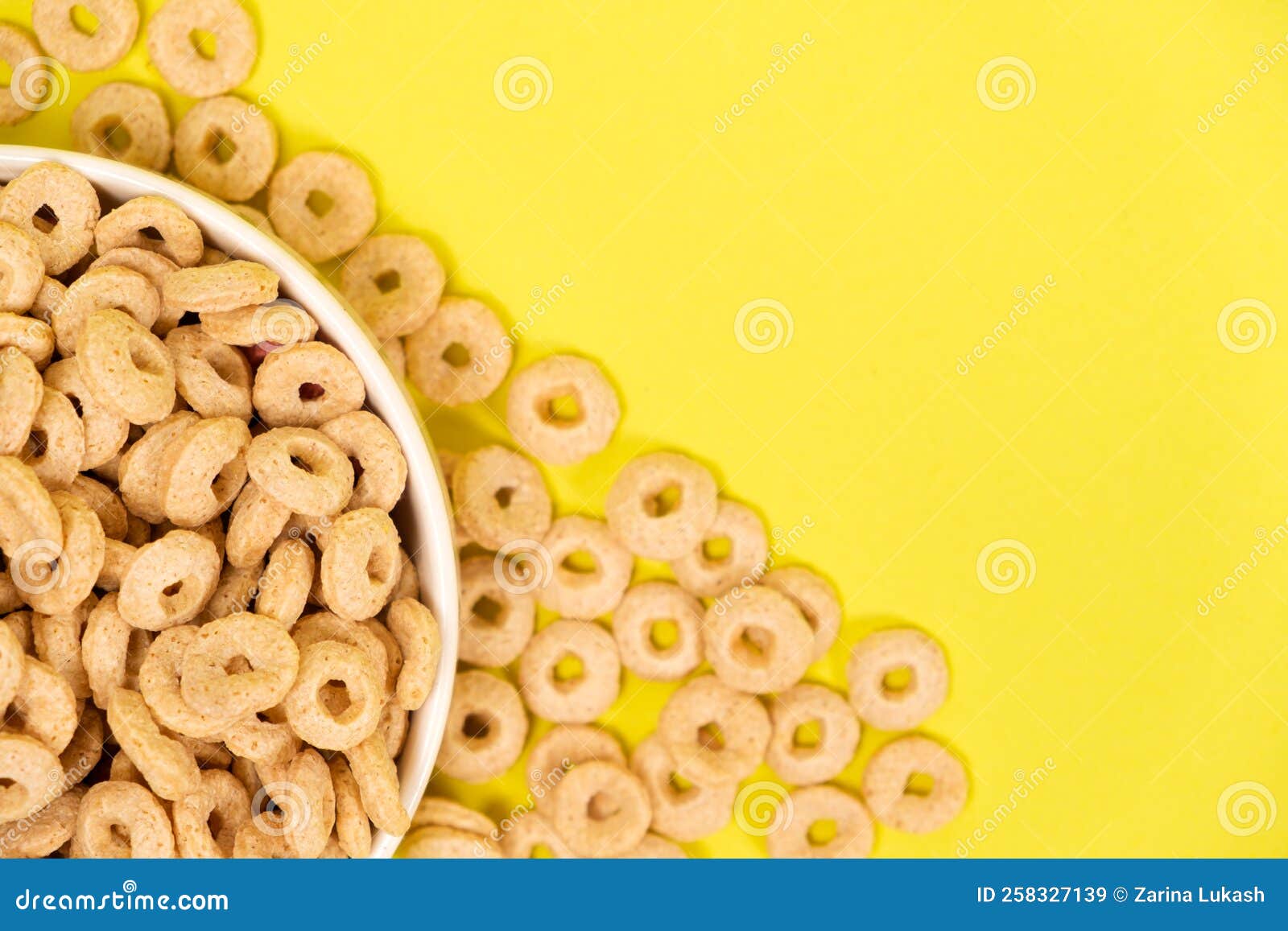 Quick Cereal Breakfast in the Form of Rings on a Plate on a Yellow ...