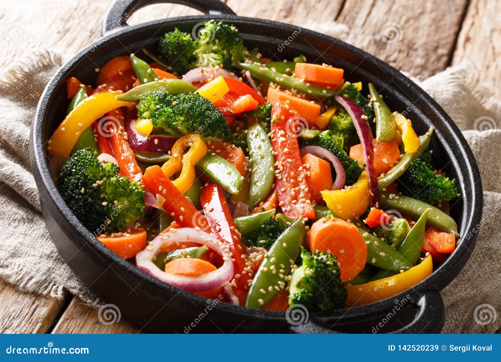 Quick-fried Vegetables with Sesame in Asian Style Close-up in a Bowl ...