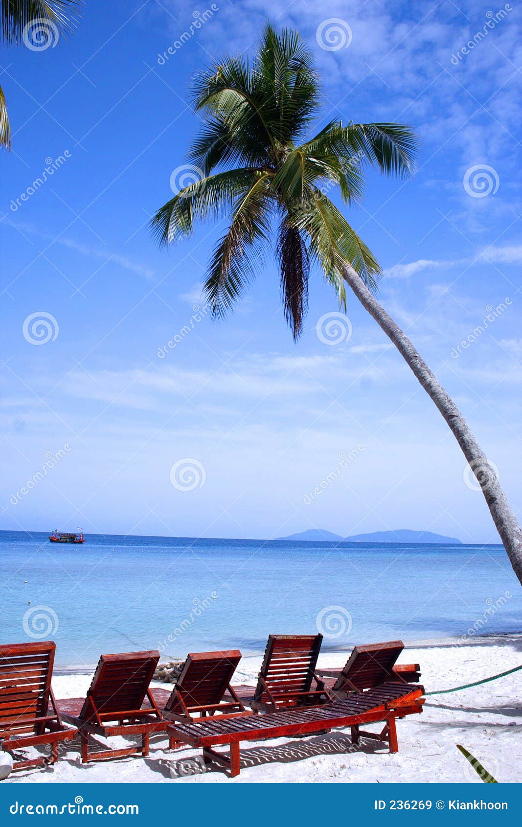 Quiet Beach stock image. Image of ocean, clear, boats, sand - 236269