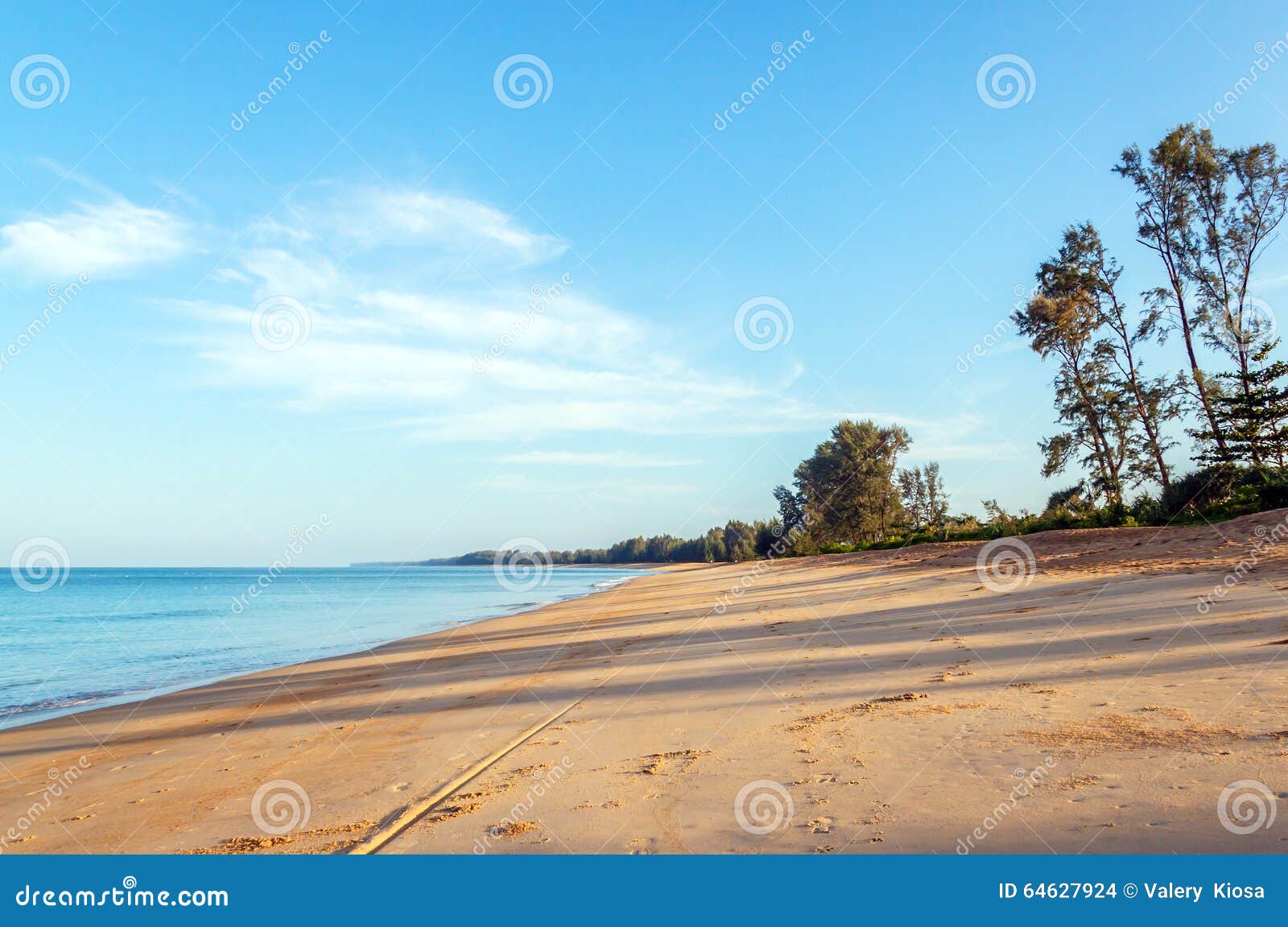 A Quiet Beach in the Early Morning Stock Photo - Image of clouds, tree ...