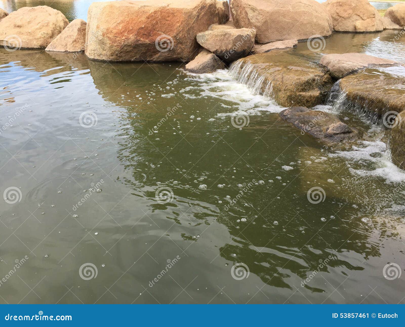 Quiet lake waterfall stock image. Image of surrounded - 53857461