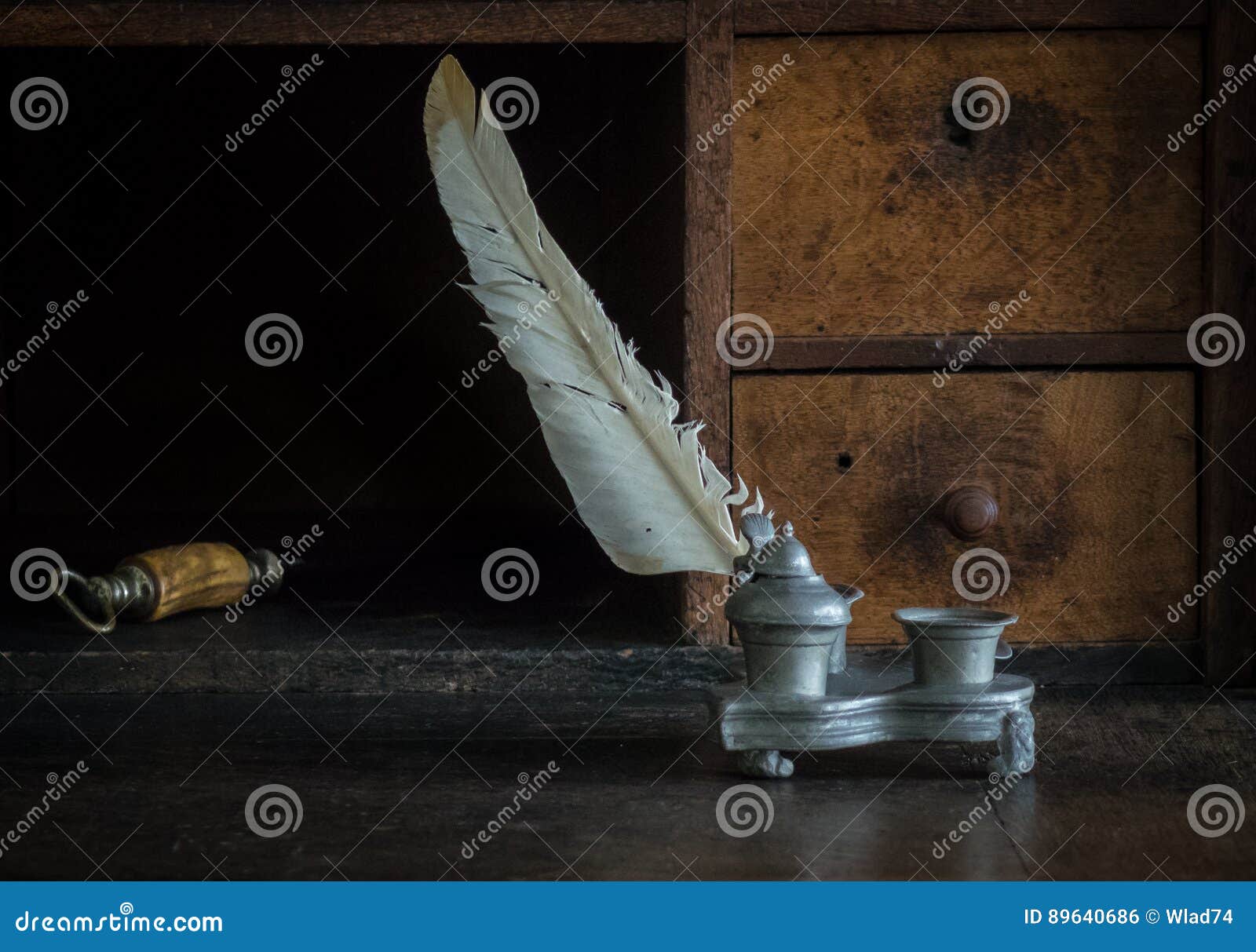 The Quill Pen in Inkwell on a Wooden Table Stock Photo - Image of ...