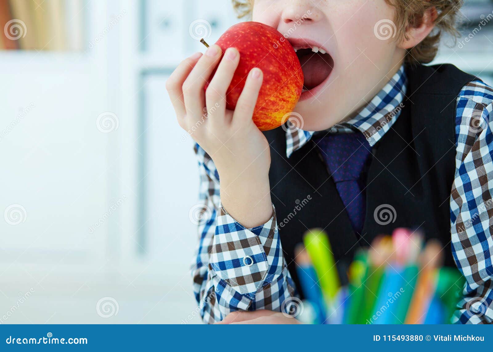 Curly Caucasian Boy with Missing Front Teeth Trying To Bite an Apple ...