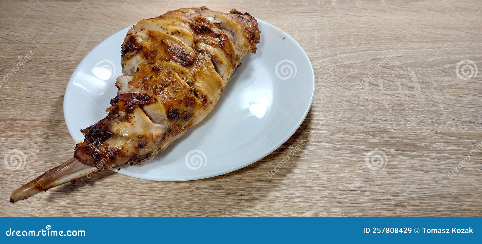 Rabbit Leg Baked in the Oven on a White Plate Stock Image - Image of ...