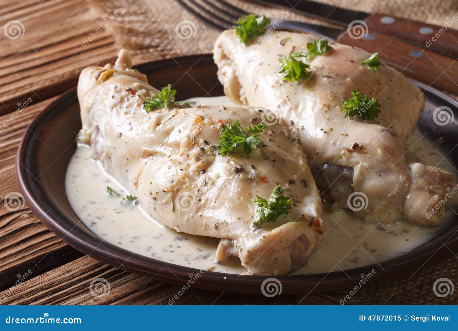 Rabbit Leg Cooked in Cream Close Up on a Plate. Horizontal Stock Image ...