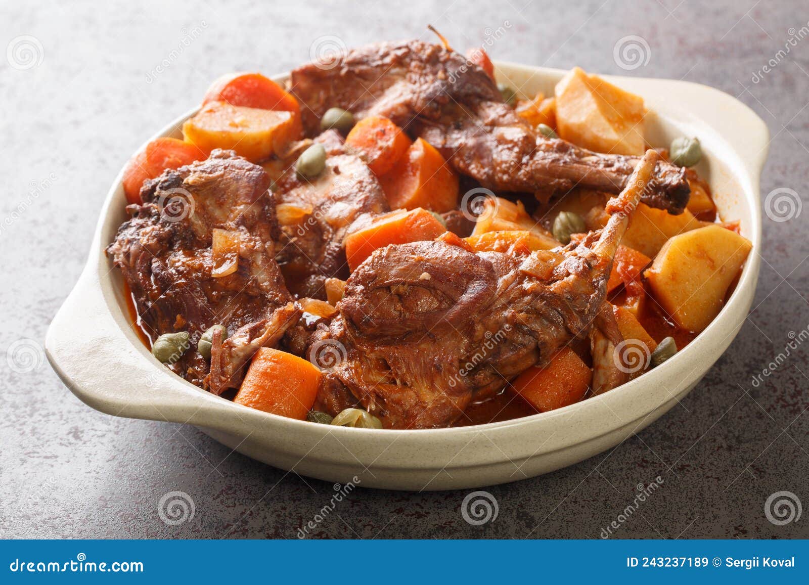 Rabbit Stew Maltese Style or Stuffat Tal-Fenek Closeup in the Pan ...