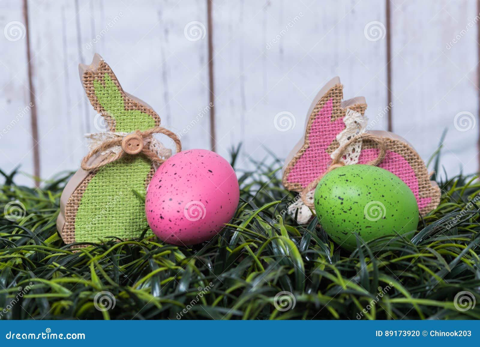 Rabbits and Eggs on Grass. Crafted Rabbits and Decorated Eggs Stock ...