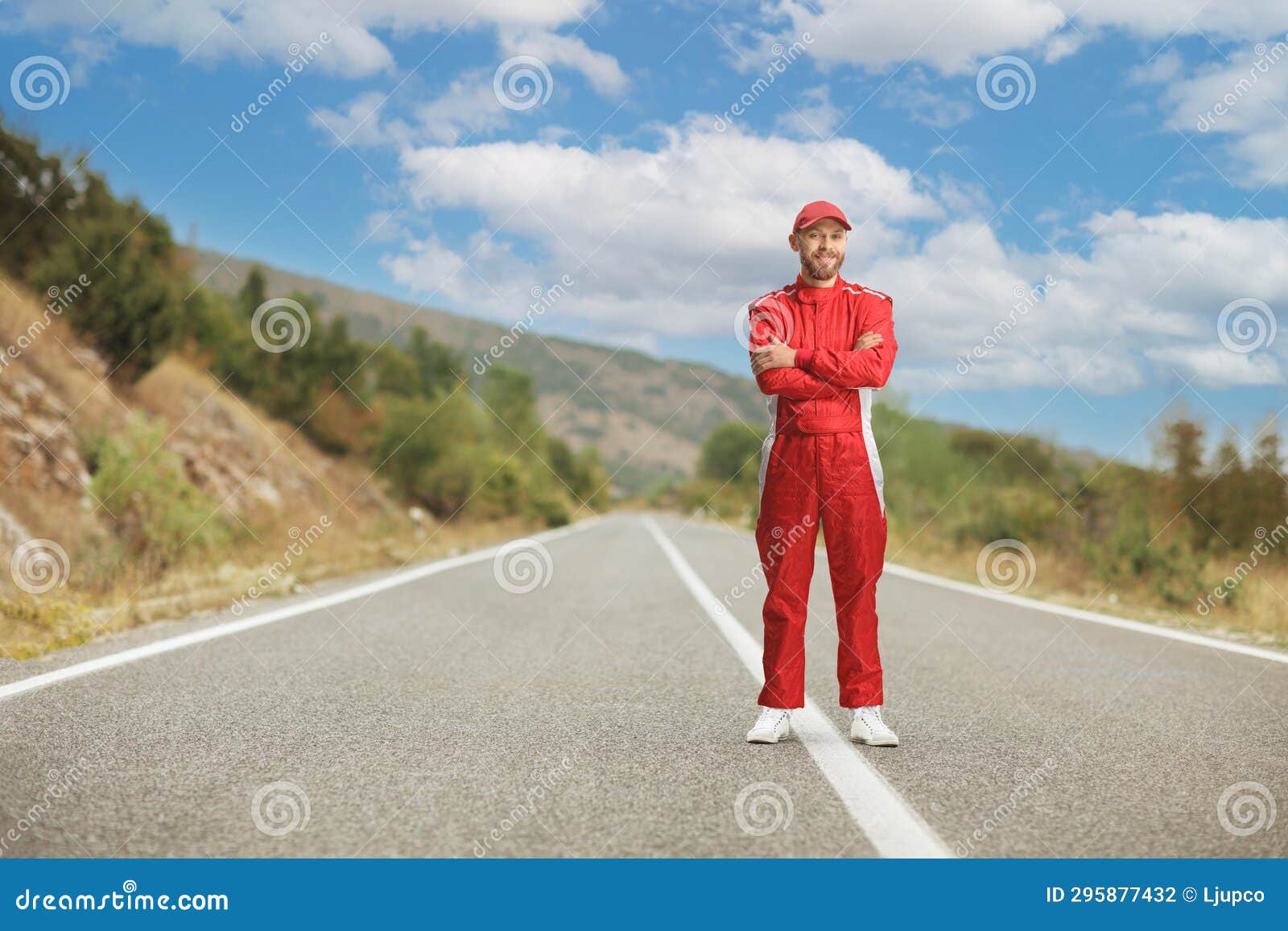 Racer in a Red Suit Standing on the Road Stock Photo - Image of safety ...