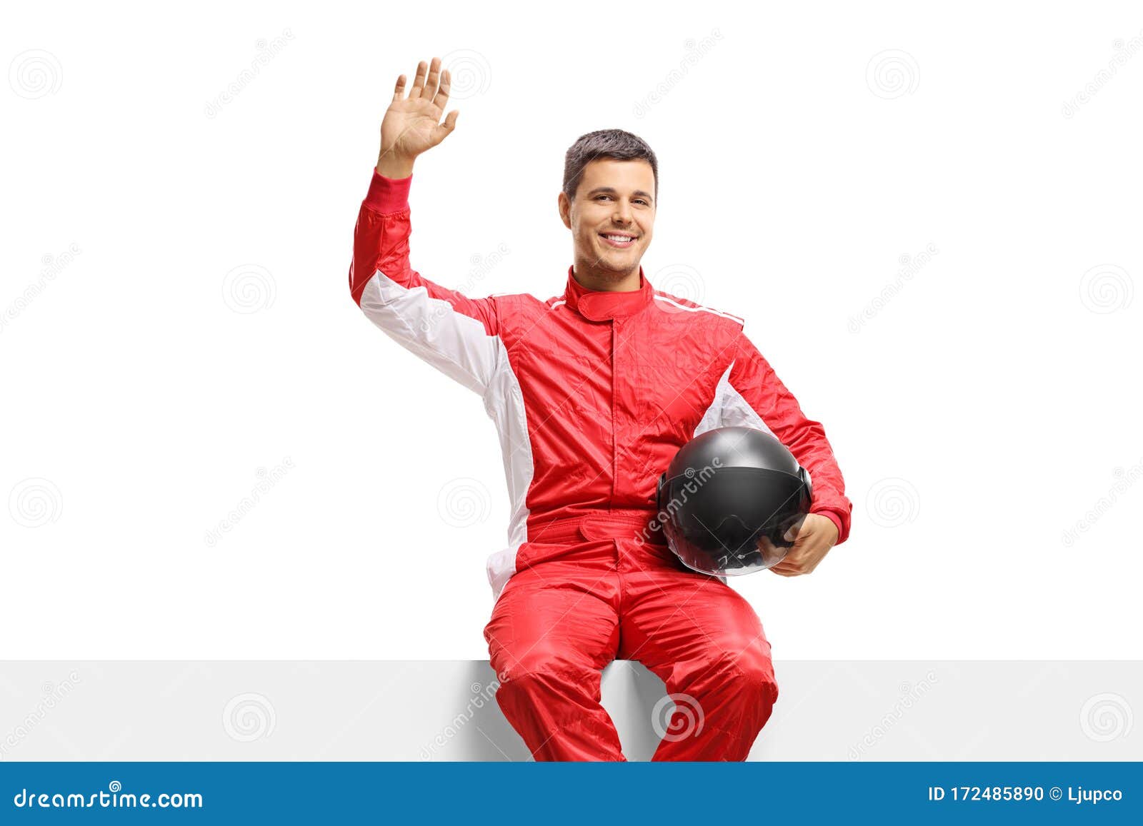 Racer Sitting on a Panel and Waving at the Camera Stock Photo - Image ...