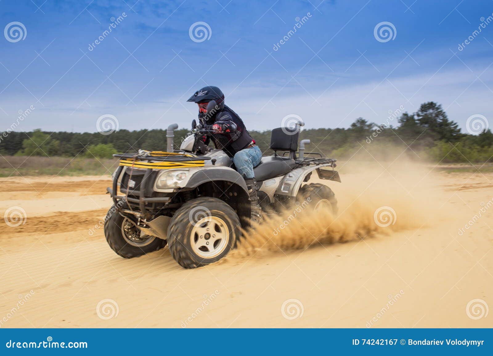 Racing ATV is sand. stock image. Image of race, dunes - 74242167