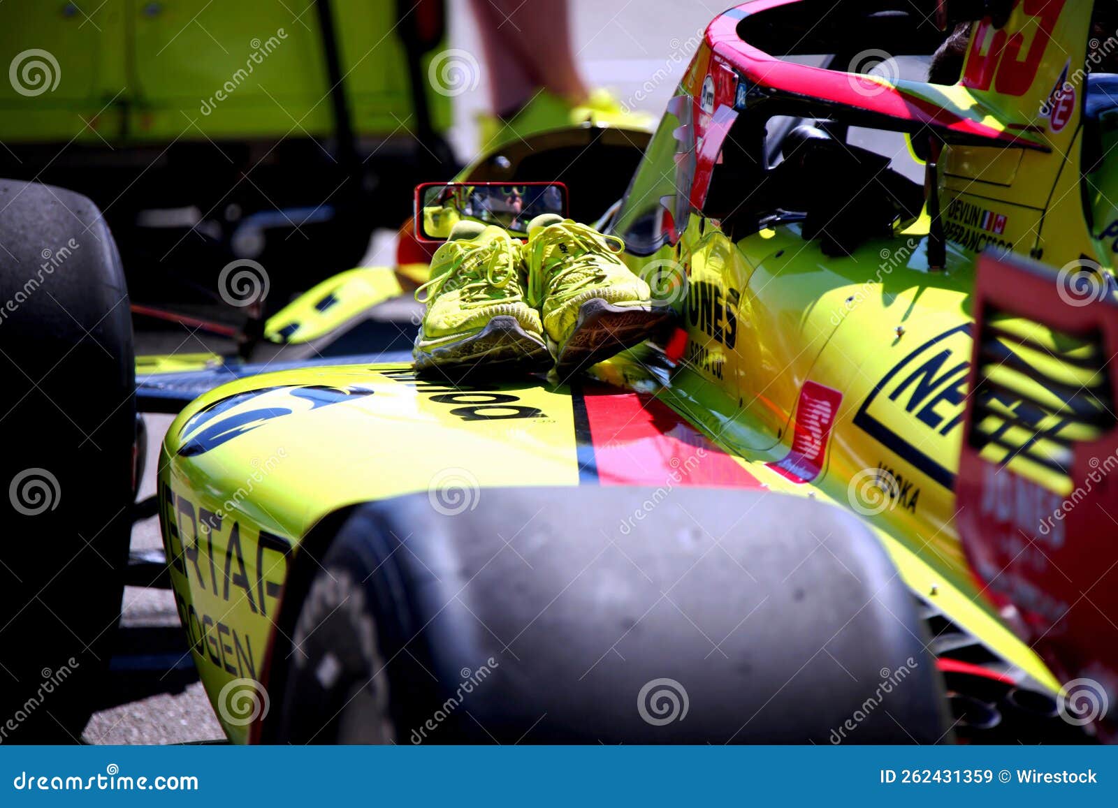 Racing Sneakers Leaning on the Side of the Race Car Editorial Stock ...