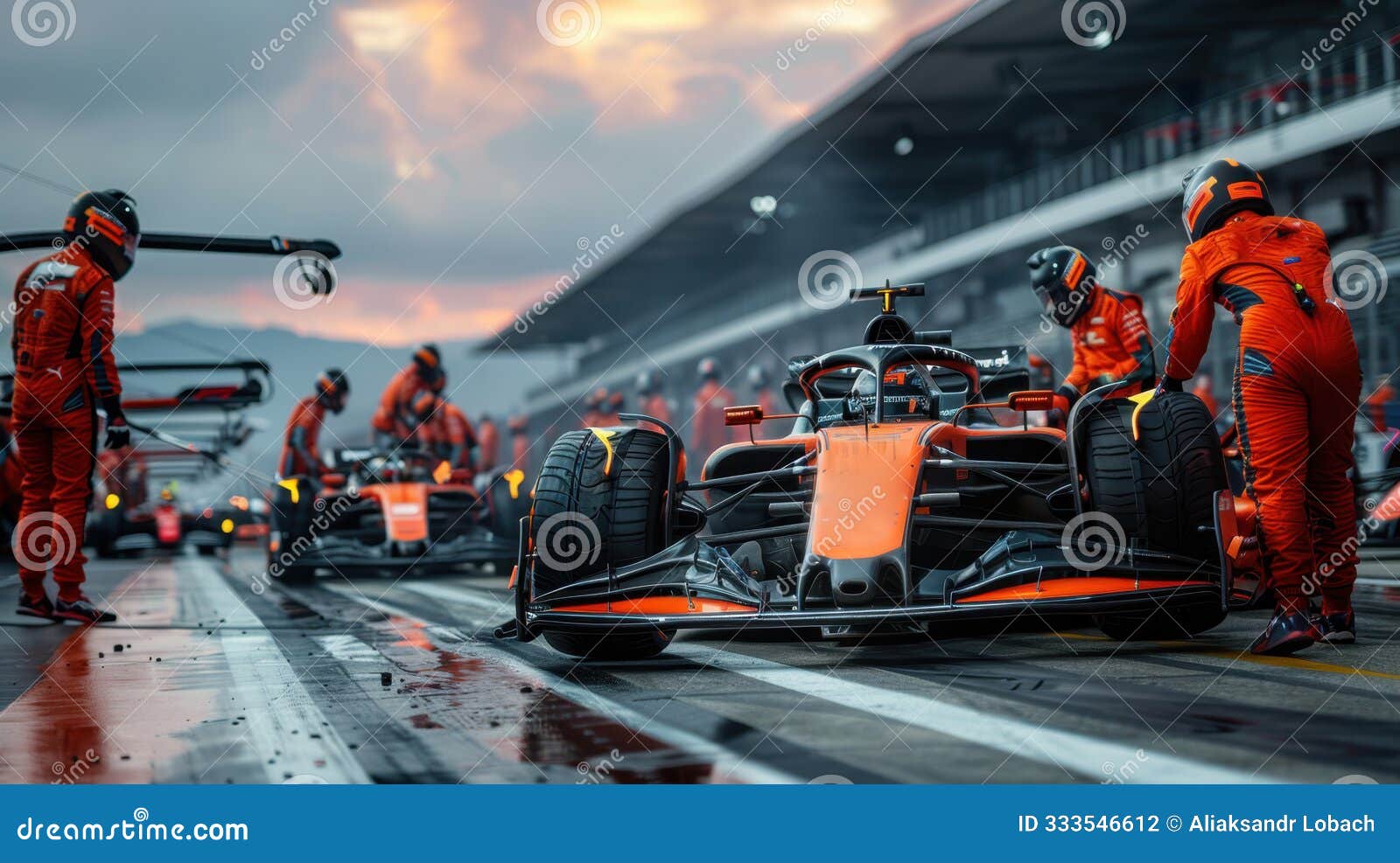 The Racing Team is Working on the Pit Stop. a Racing Car Goes through a ...