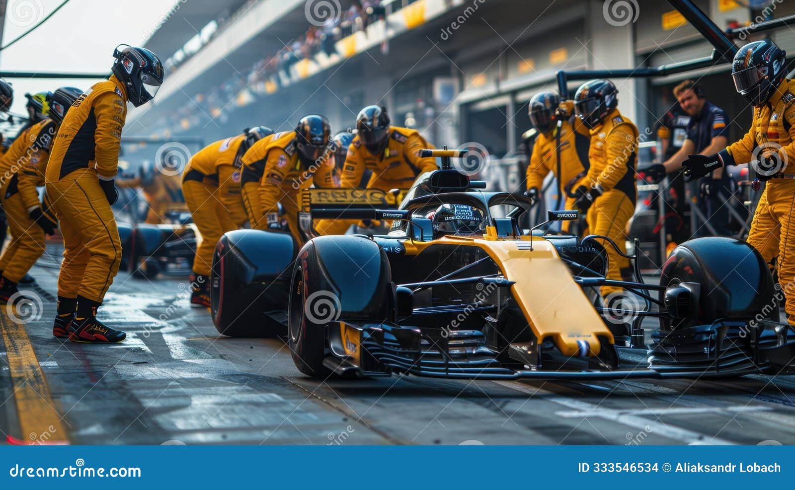The Racing Team is Working on the Pit Stop. a Racing Car Goes through a ...