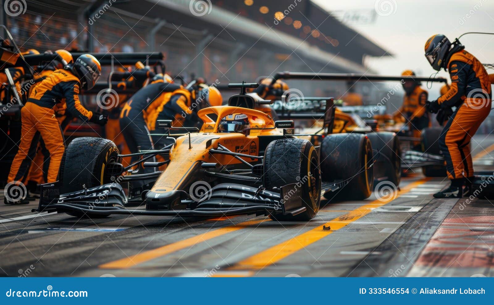 The Racing Team is Working on the Pit Stop. a Racing Car Goes through a ...