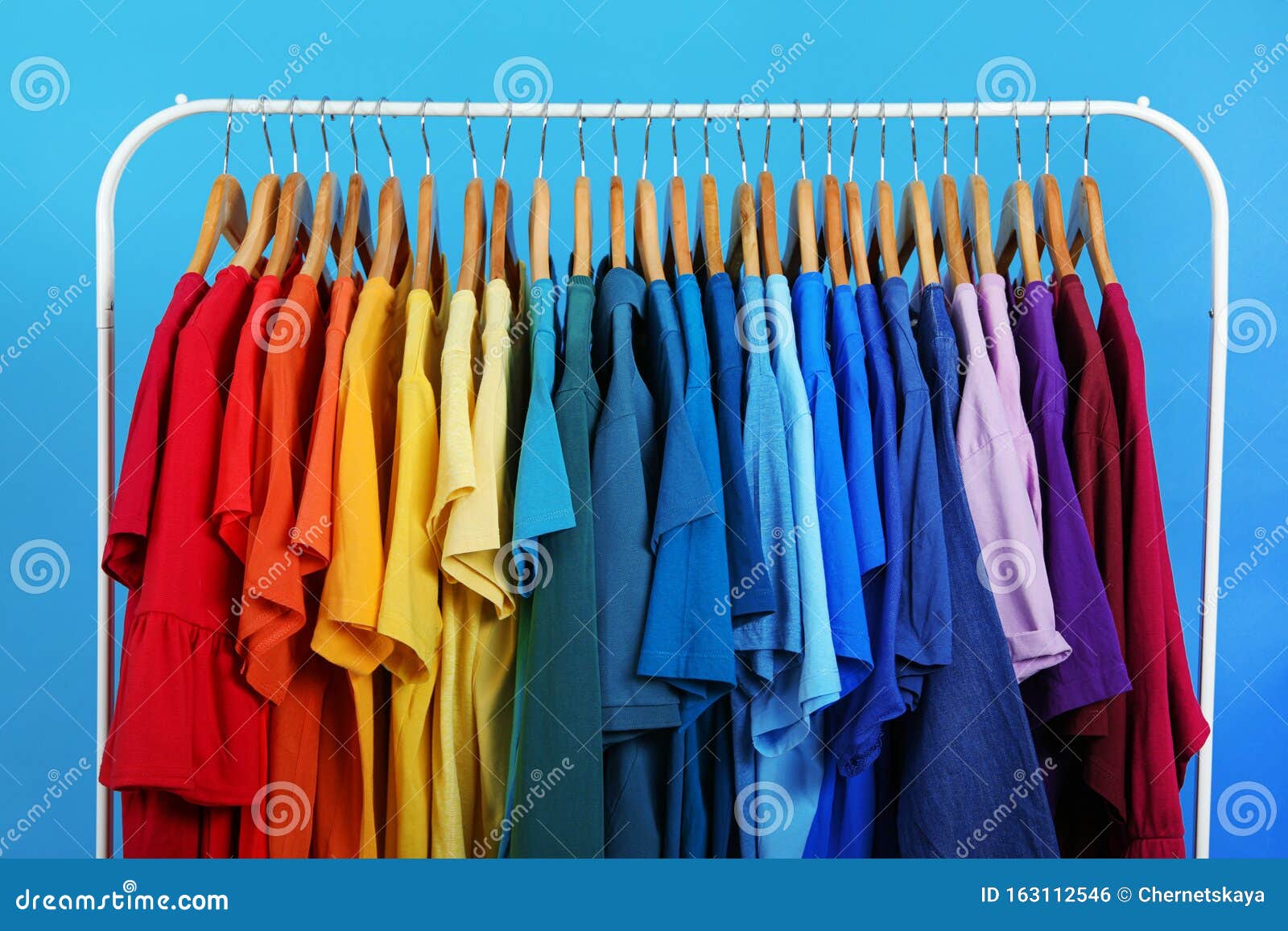 Rack with Bright Clothes on Background. Rainbow Colors Stock Photo ...