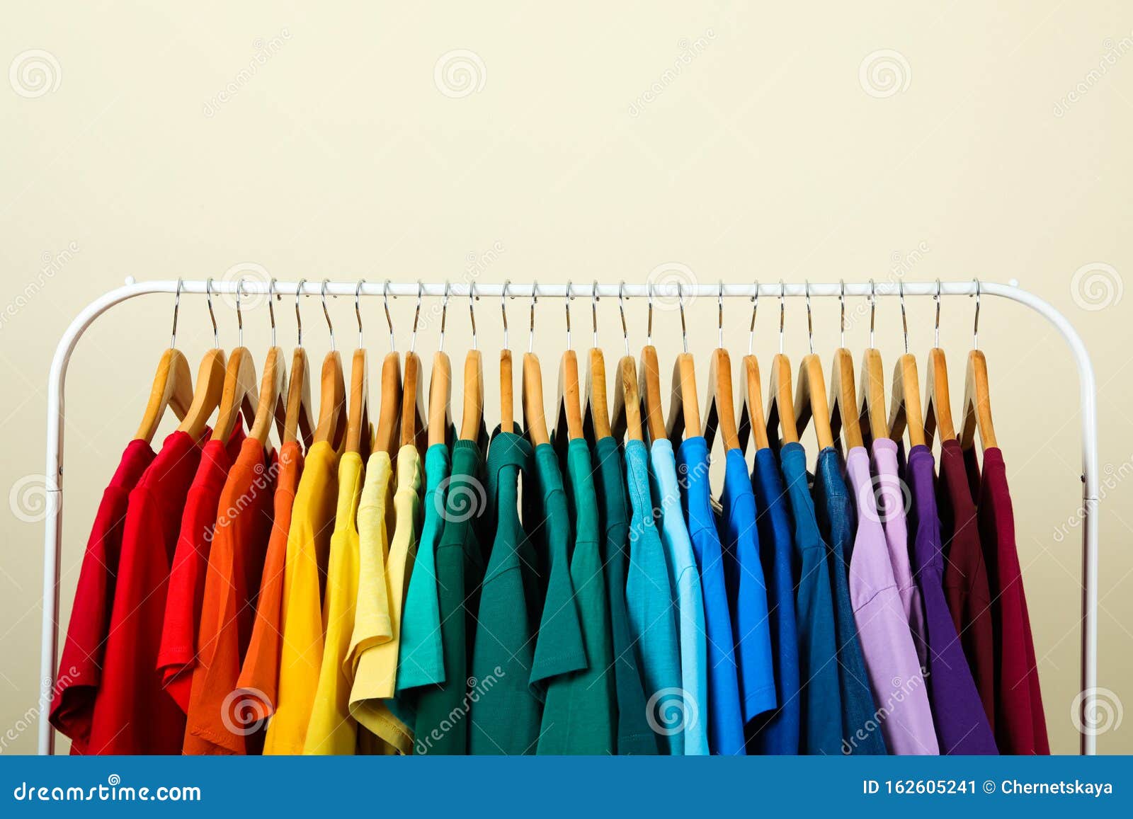 Rack with Bright Clothes on Background. Rainbow Colors Stock Image ...