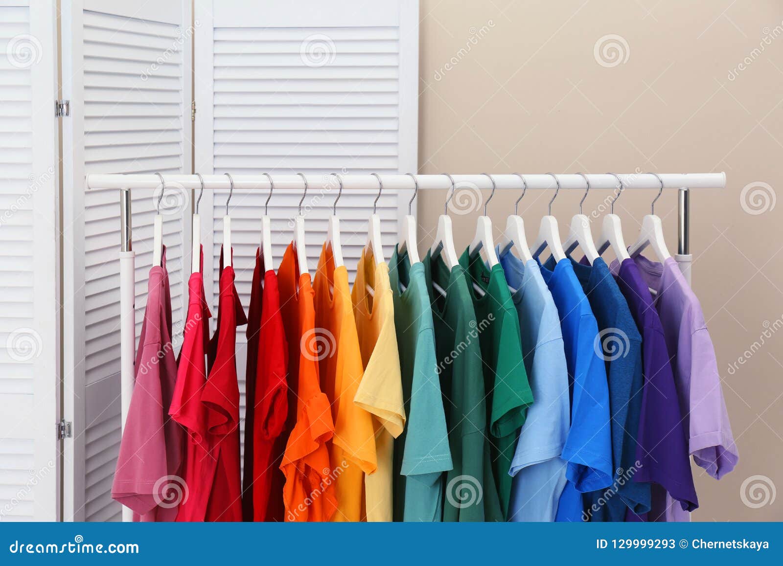 Rack with Bright Clothes in Room Stock Image - Image of clothes, color ...