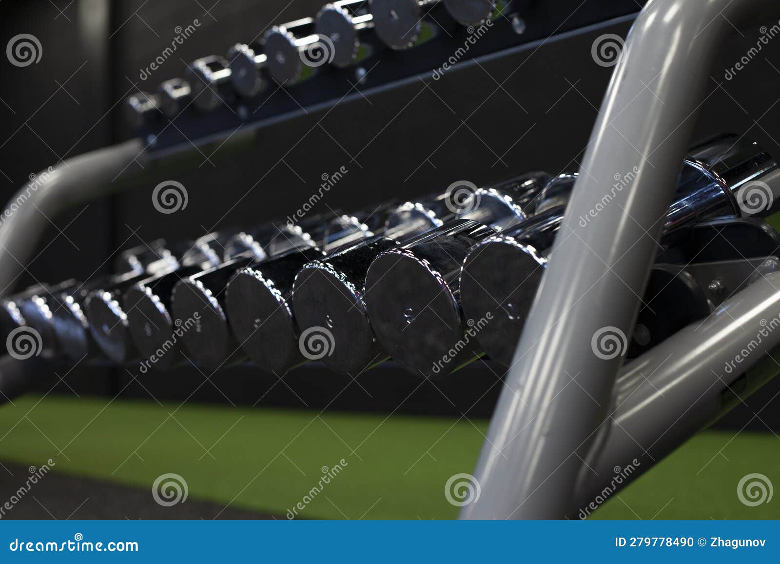 Rack with chrome dumbbells stock photo. Image of metal - 279778490