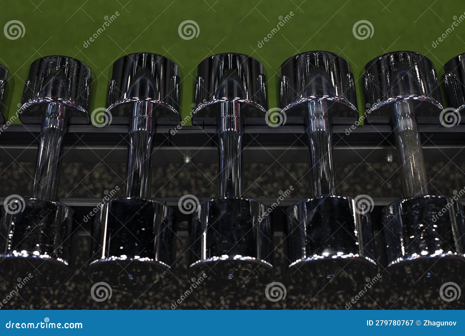 Rack with chrome dumbbells stock image. Image of chrome - 279780767