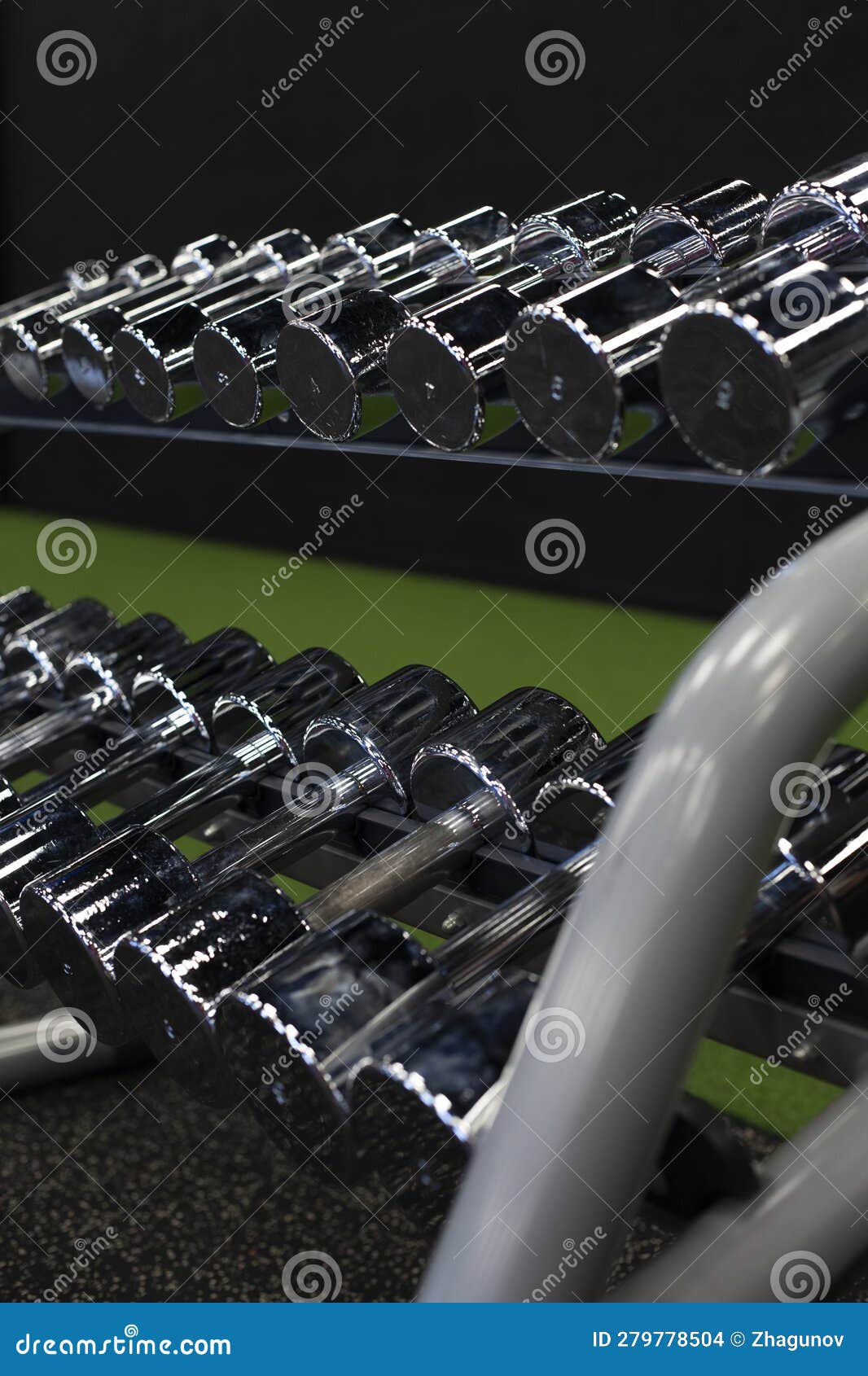 Rack with chrome dumbbells stock photo. Image of metal - 279778504