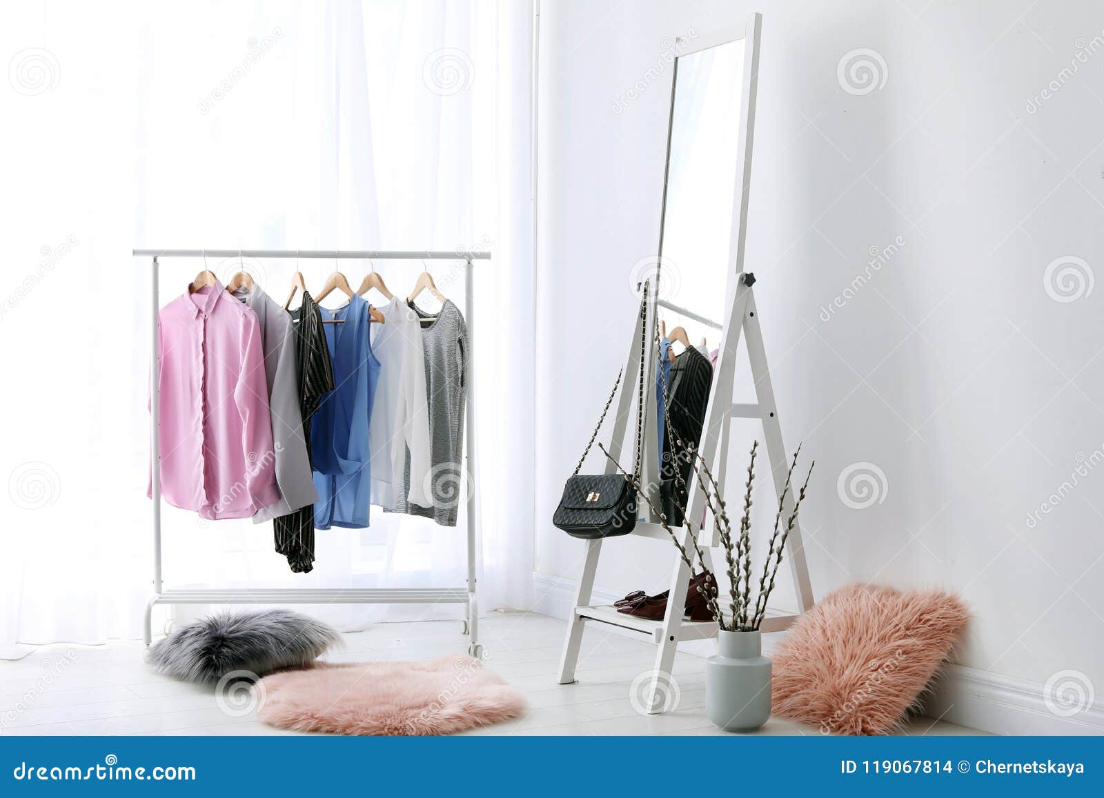 Rack with Clothes and Modern Mirror in Room Stock Photo - Image of ...