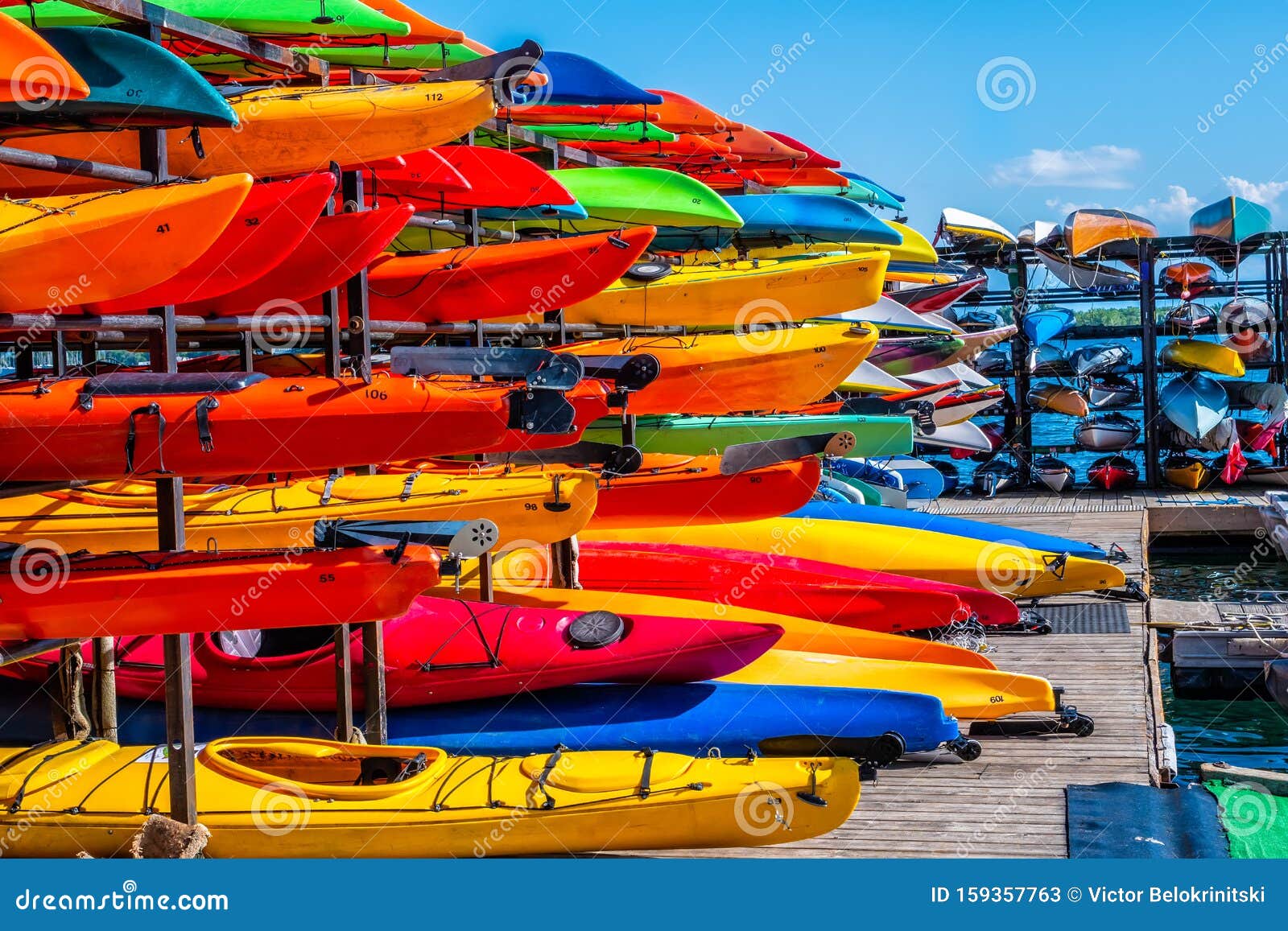 Rack of Colorful Kayaks and Canoes. Stock Image - Image of colorful ...