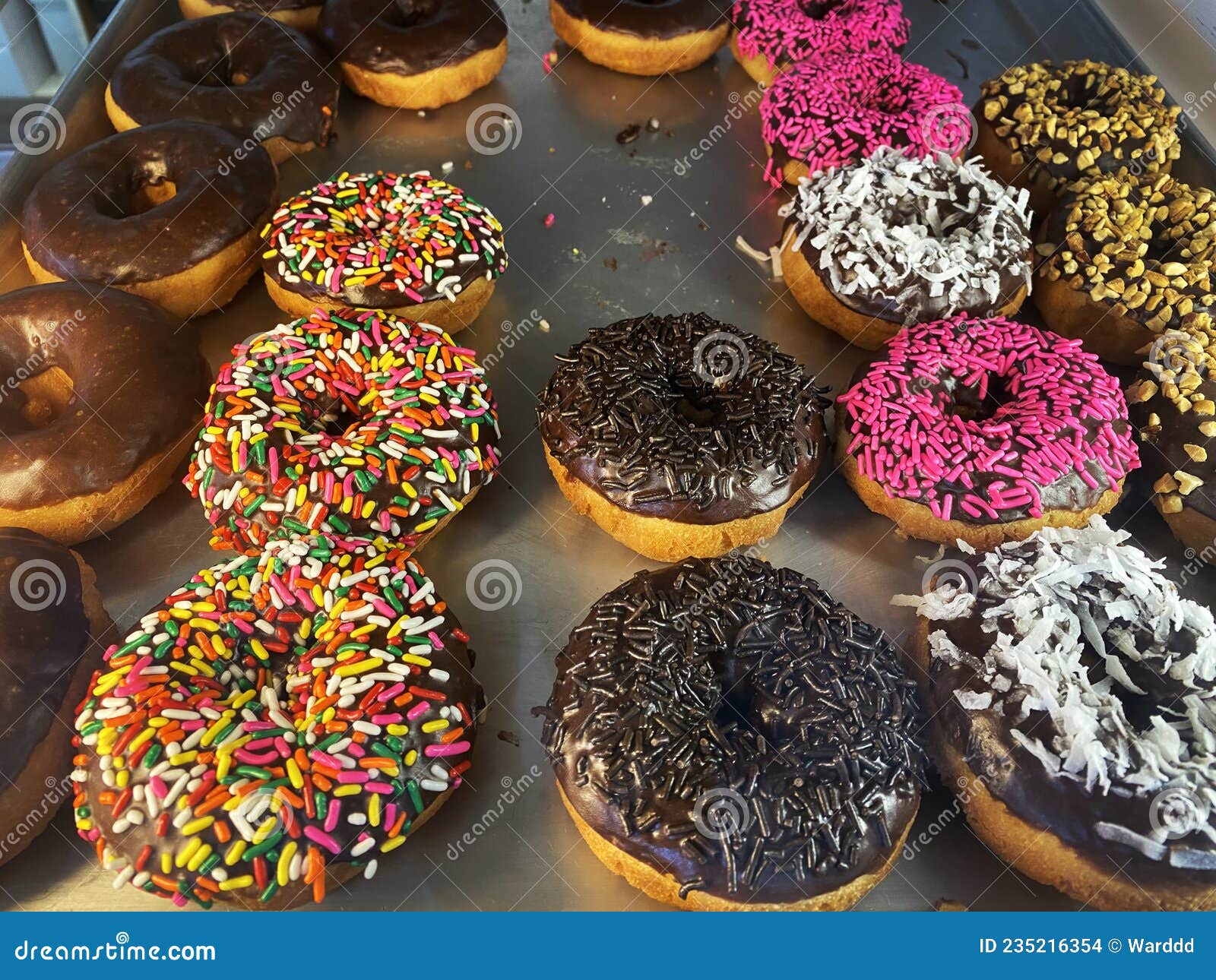 A Rack of Donuts with Sprinkles Stock Photo - Image of rack, snack ...