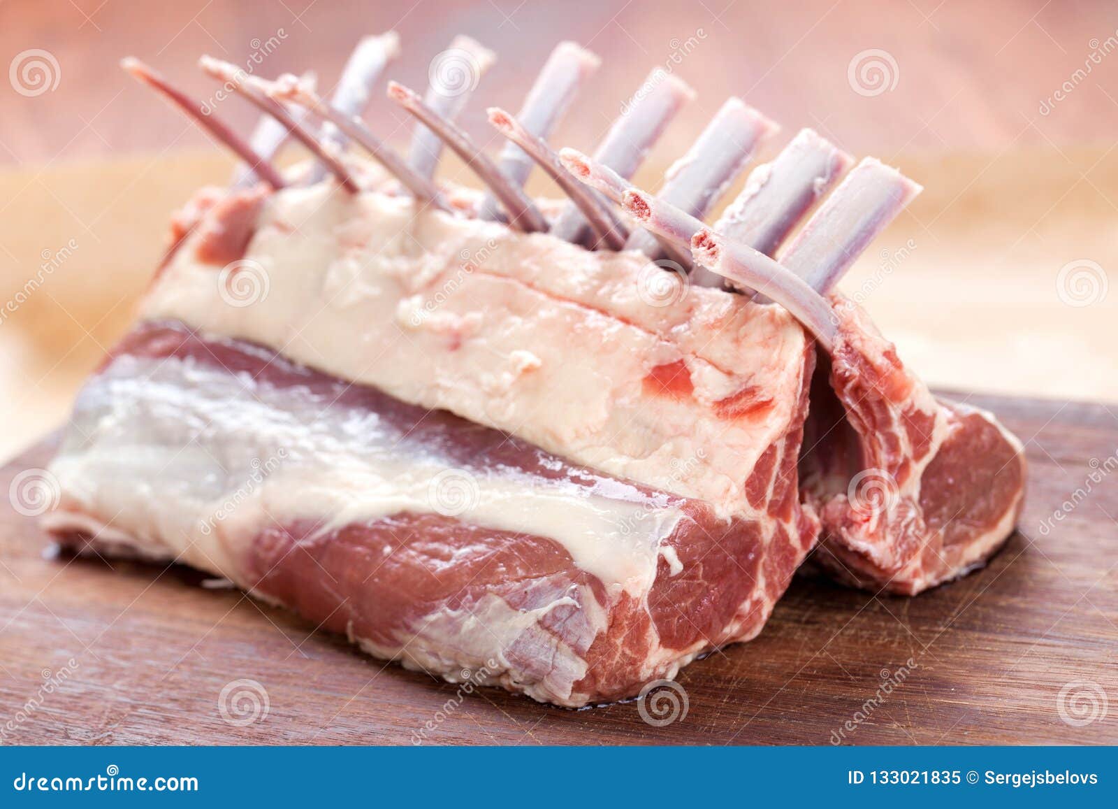 Rack of Lamb , Raw Meat with Bone on Rustic Kitchen Table at Wooden ...