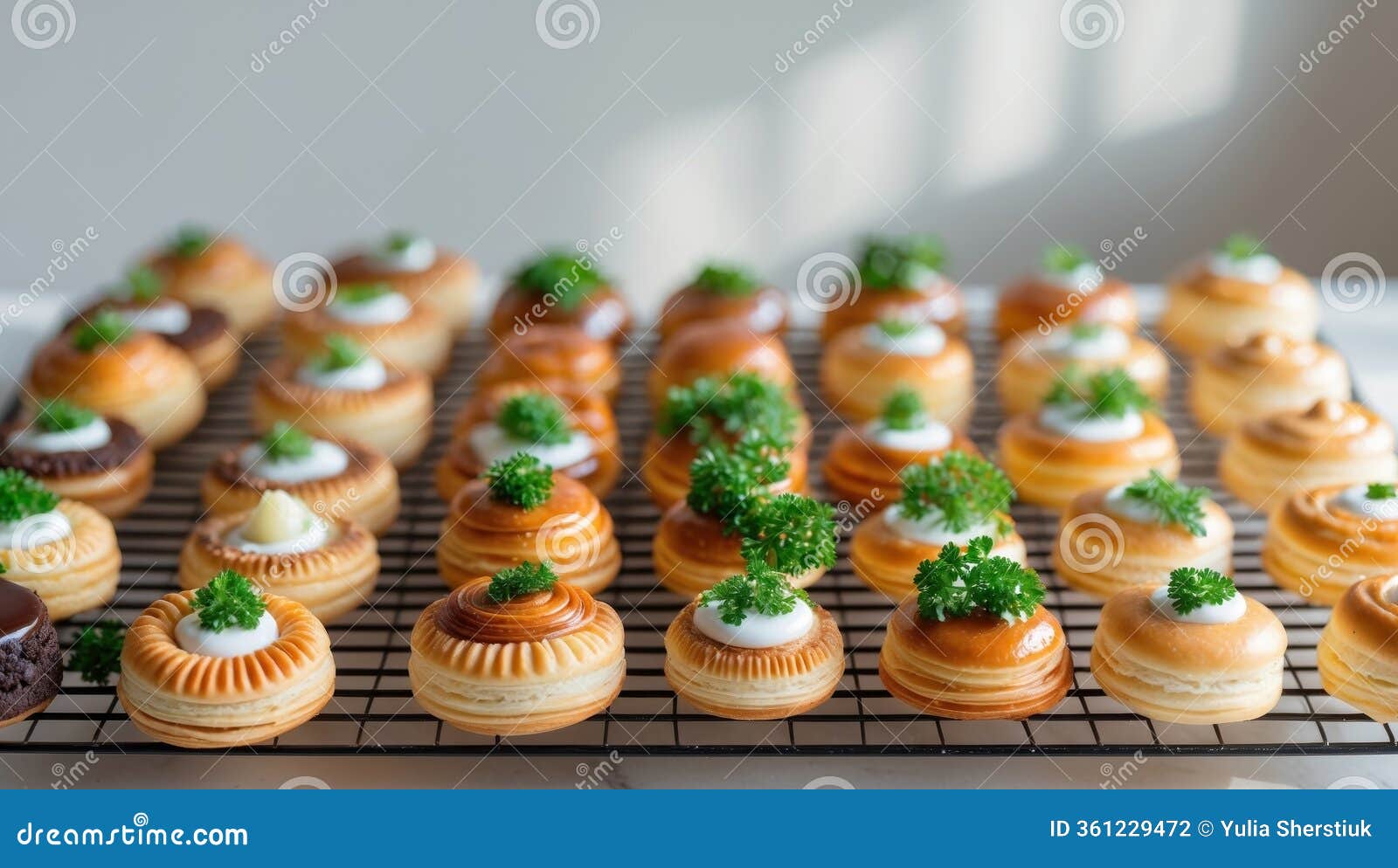 A Rack of Mini Pastries with Parsley on Top. Stock Photo - Image of ...