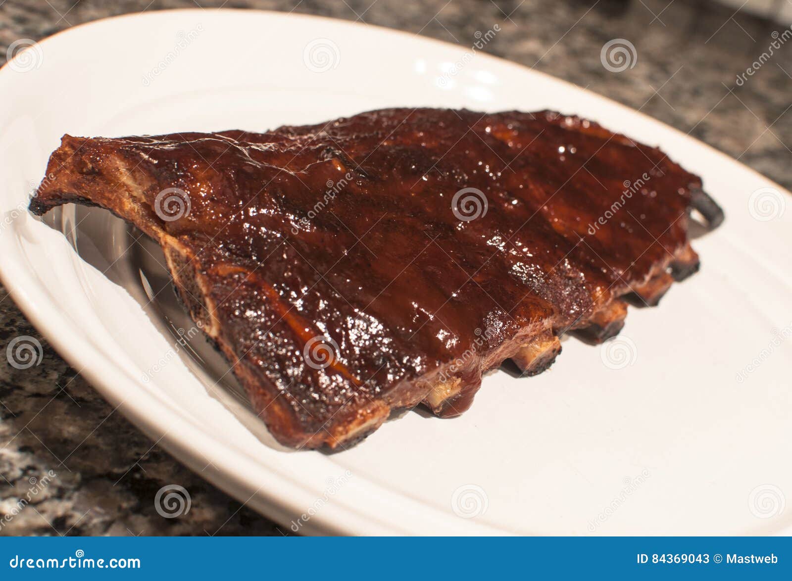 Rack of ribs on a plate stock image. Image of back, dinner - 84369043