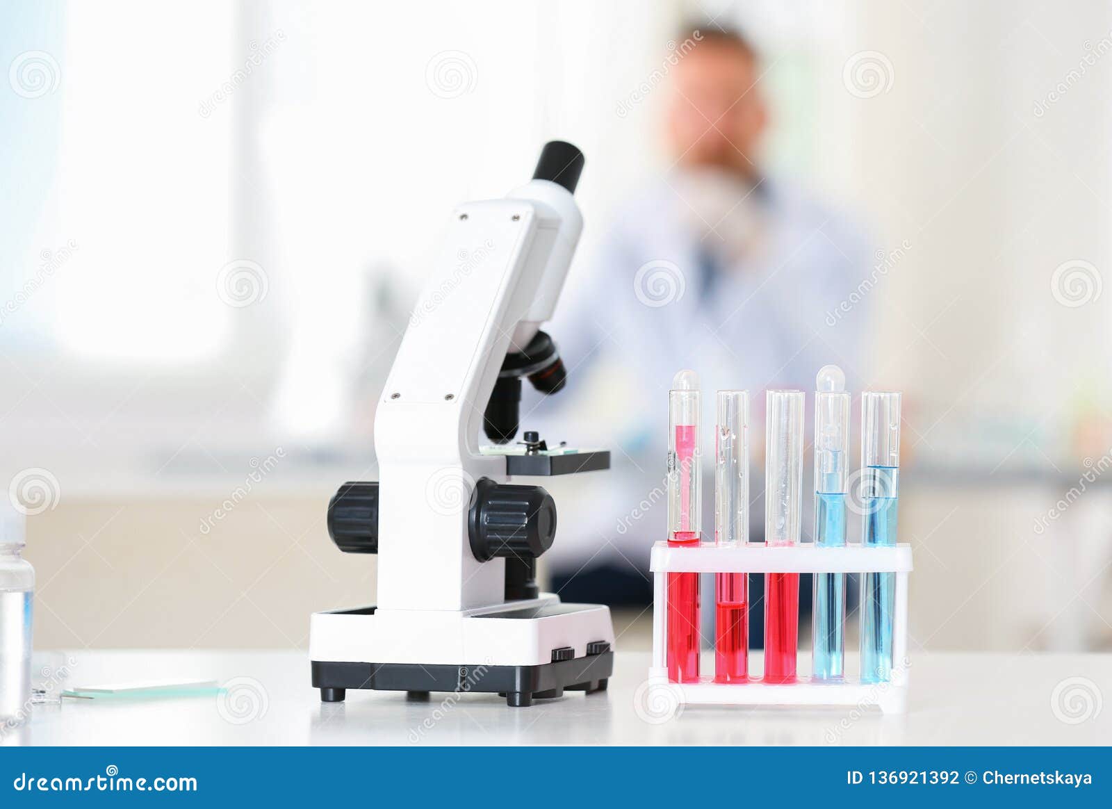 Rack with Test Tubes and Microscope on Table in Laboratory Stock Photo ...
