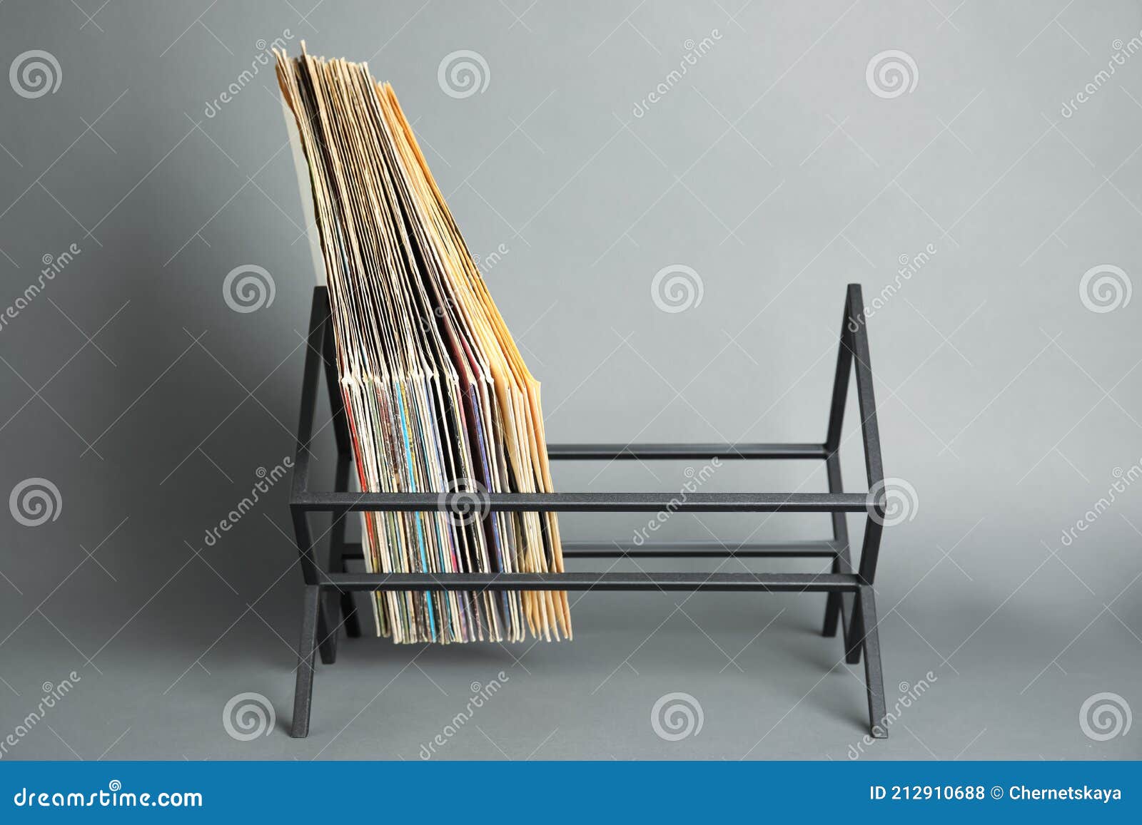 Rack with Vinyl Records in Sleeves on Grey Background Stock Photo ...