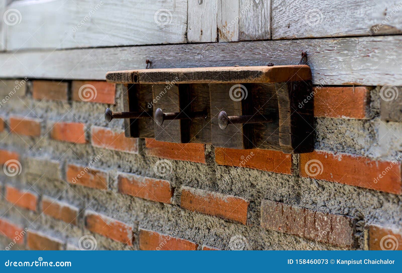 Rack on the Weathered White Brick Wall. Old Wall Hook Rack Stock Image ...