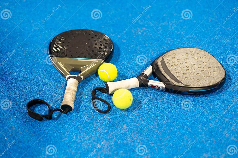 Rackets Paddle with Two Balls on Blue Background Stock Photo - Image of ...