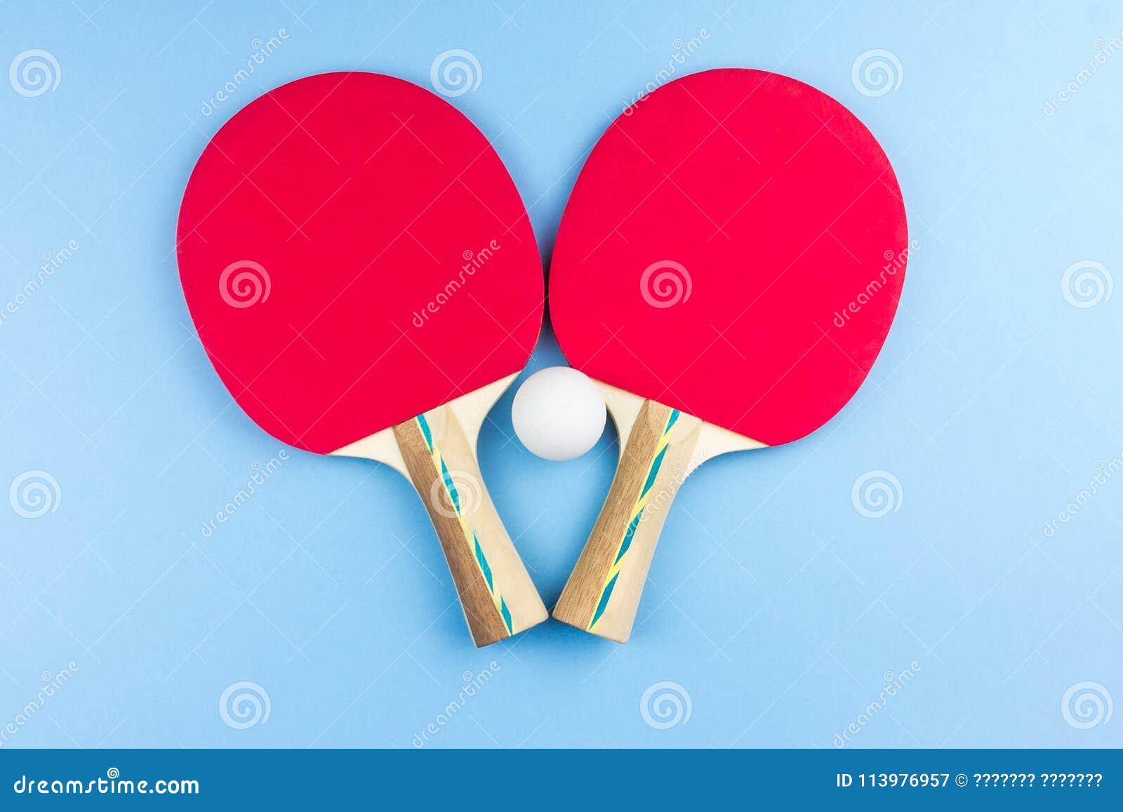 Two Rackets For A Table Tennis Or Ping-Pong And A Ball On A Blue Table ...