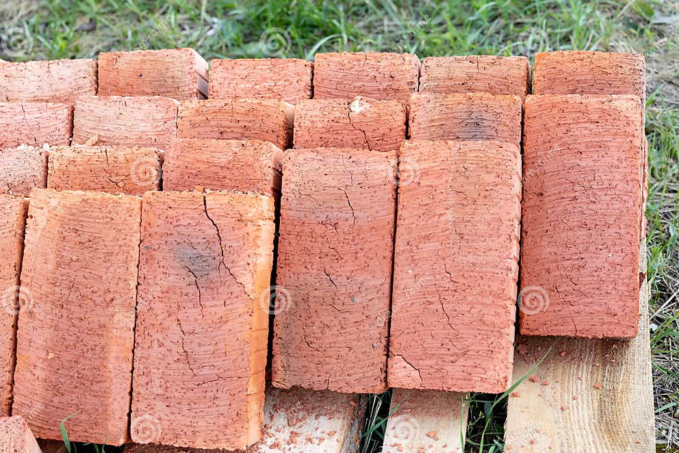 Racks with Full-bodied Bricks. Several Pallets of Red Bricks are ...