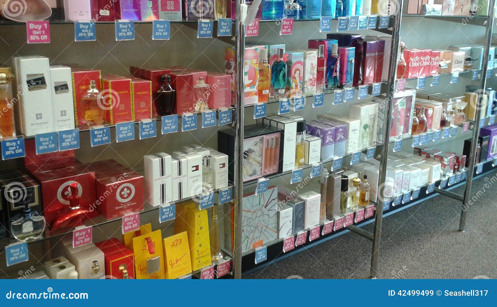 Racks of perfume editorial stock image. Image of boxes - 42499499