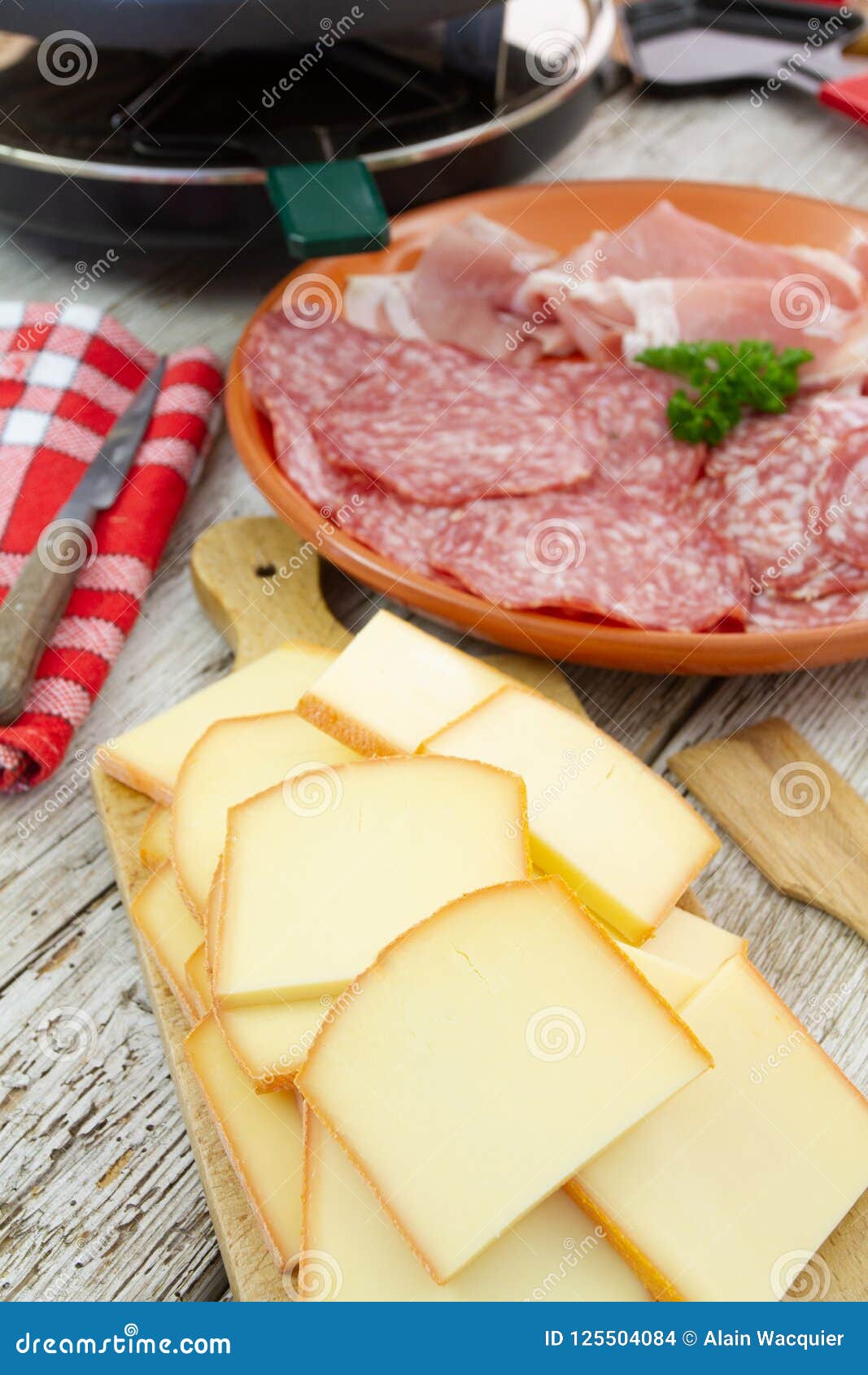 Raclette cheese stock photo. Image of salami, cheese - 125504084