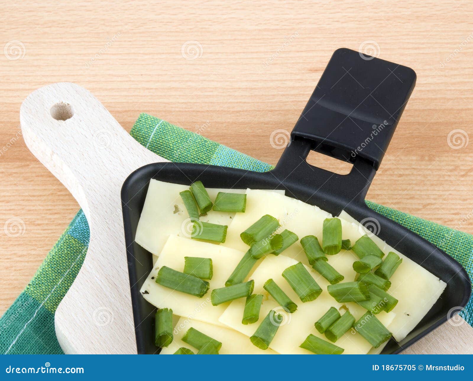 Raclette Pan with Cheese and Spring Onion Stock Image - Image of table ...