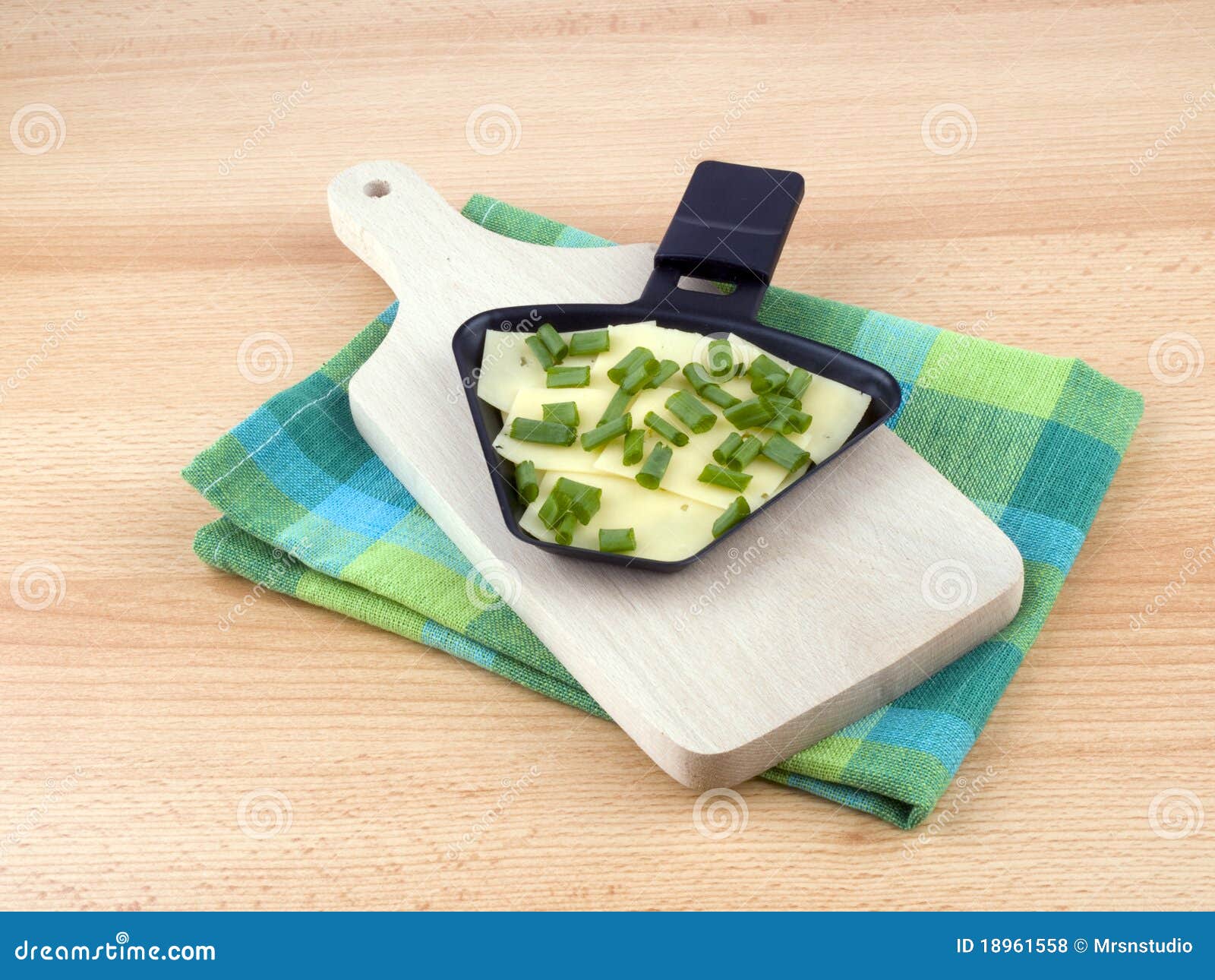 Raclette Pan with Cheese and Spring Onion Stock Photo - Image of board ...