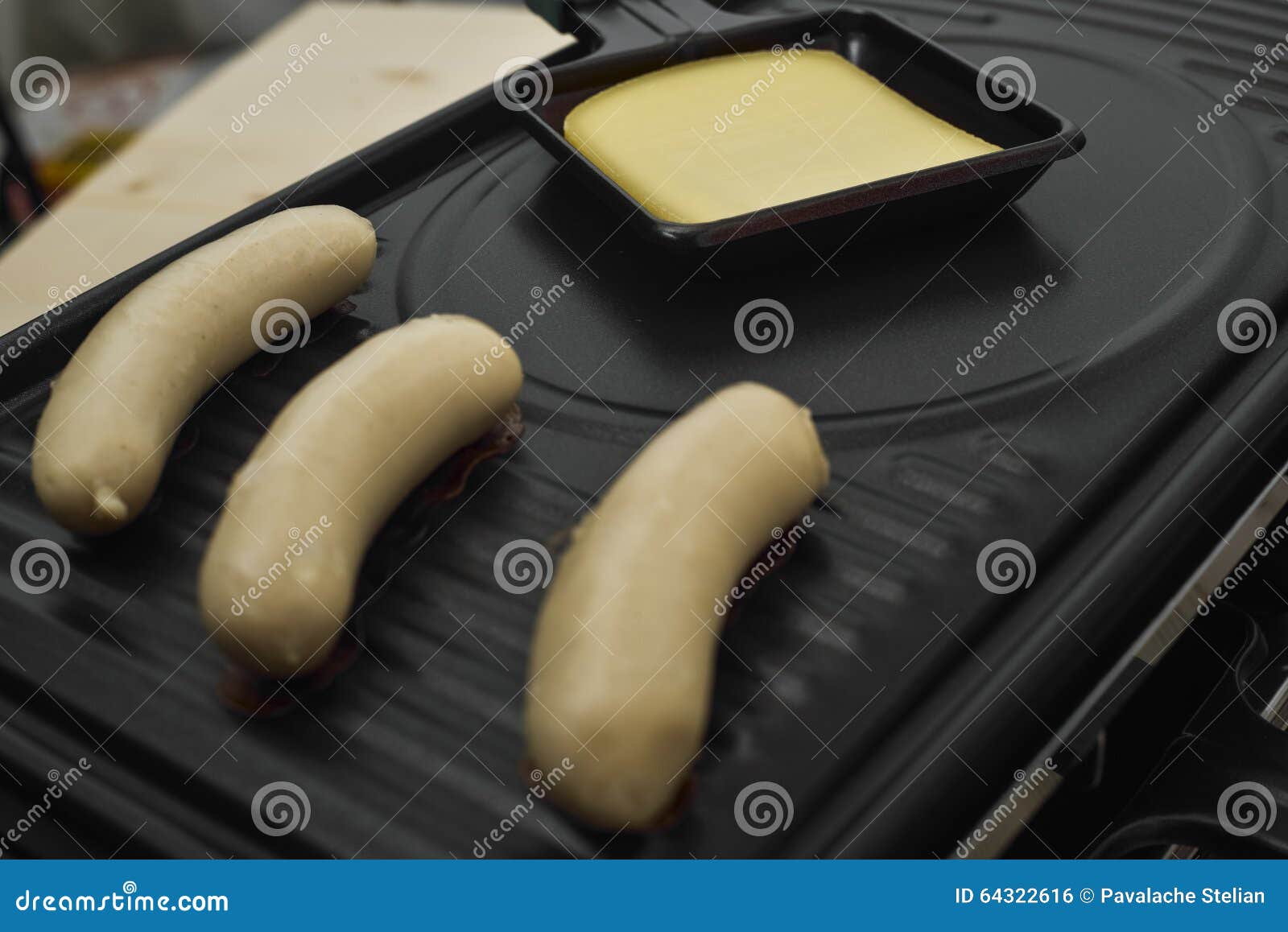 Raclette Table with Sausages and Cheese Stock Photo - Image of group ...