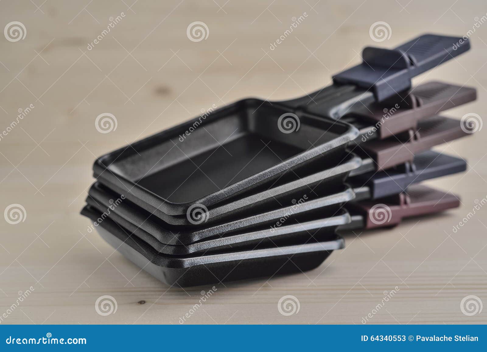 Raclette trays stock image. Image of dinnerware, gourmet - 64340553