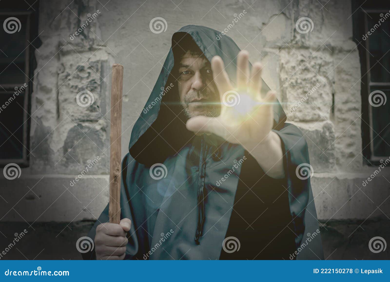 An Elderly Monk Of 45-50 Years Old With A Beard And A Black Robe With A ...