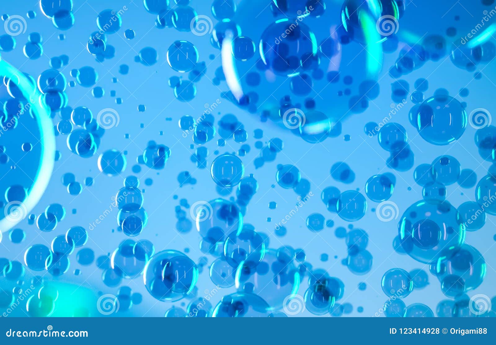Radiant Soap Bubbles on Blurred Blue Background. Rainbow Soap Bubble ...