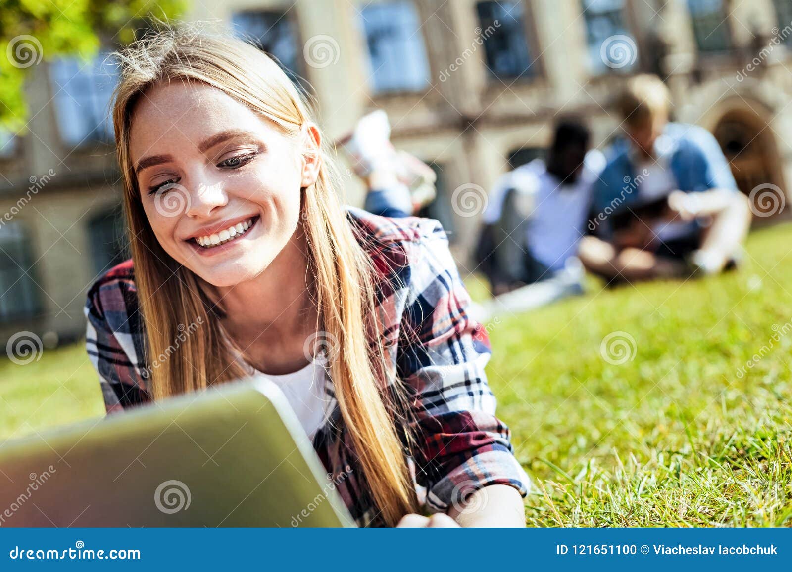 Radiant Student Beaming while Working on Laptop Stock Photo - Image of ...