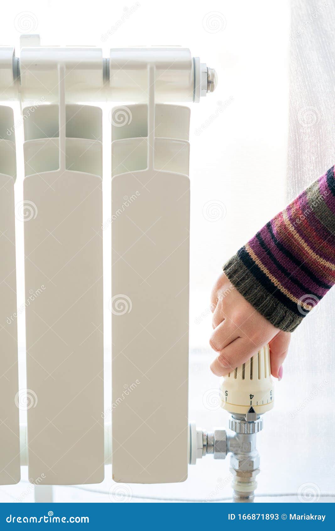 Radiator Adjustment Closeup. Female Hand Adjusting Radiator Temperature ...